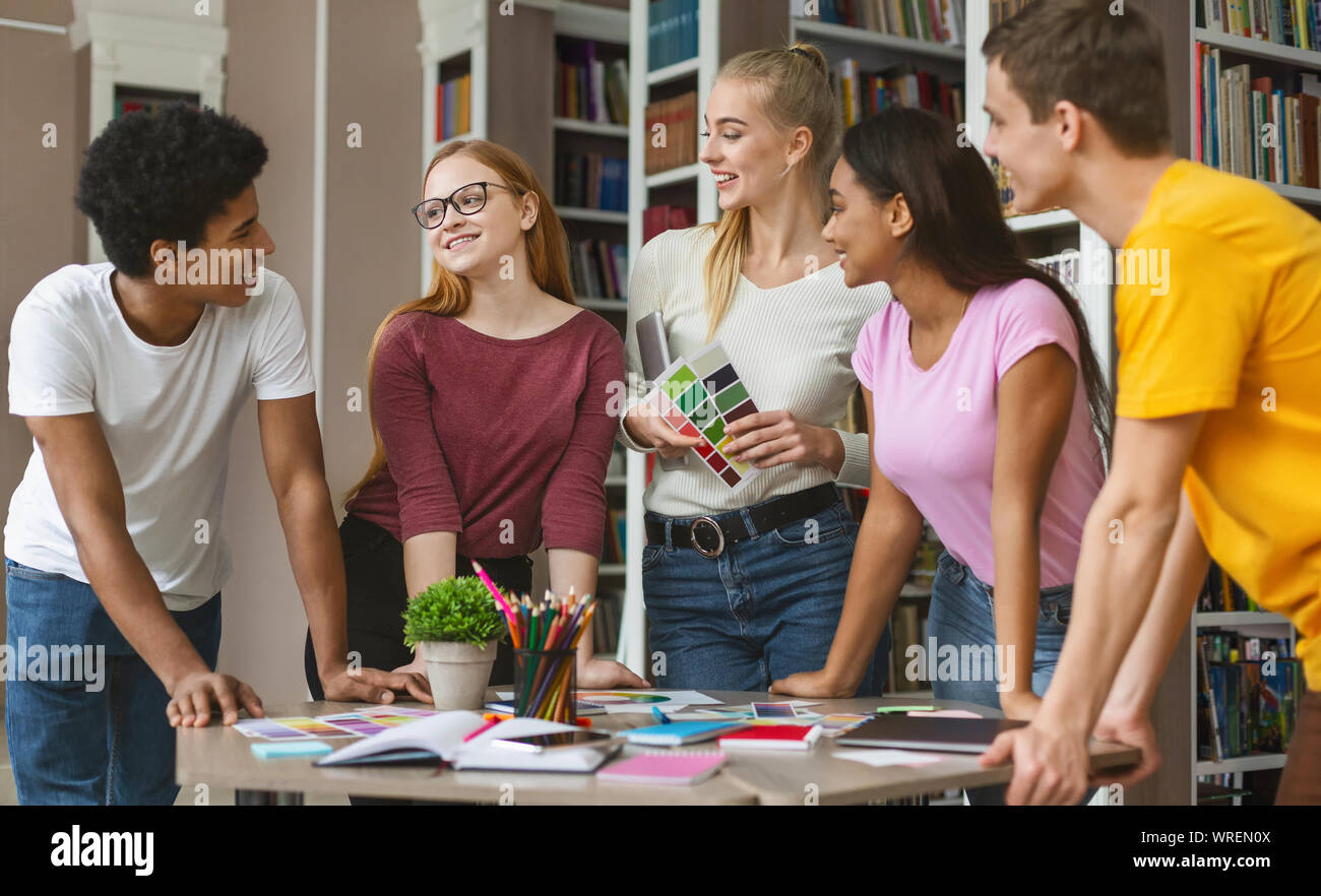 Group of students choosing color for future project Stock Photo - Alamy