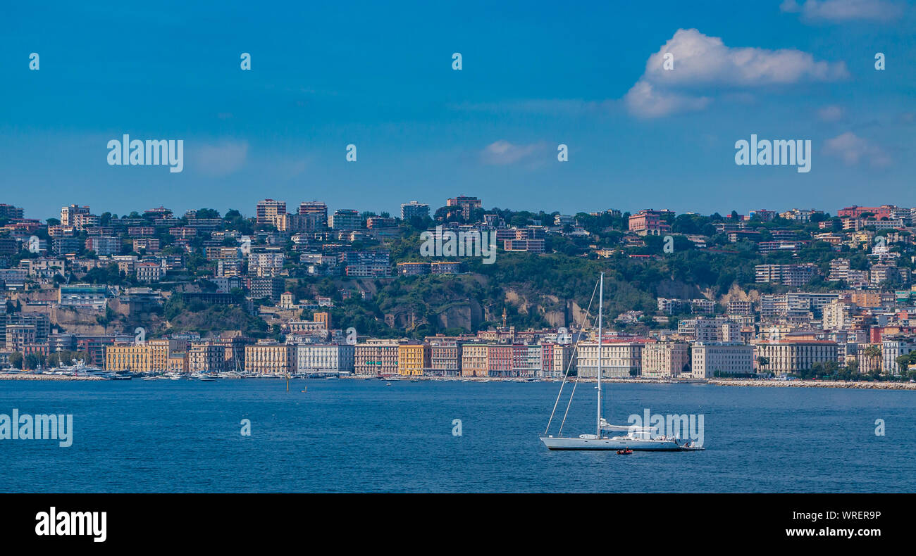 A picture of a sailing boat with the Chiaia district in the back ...