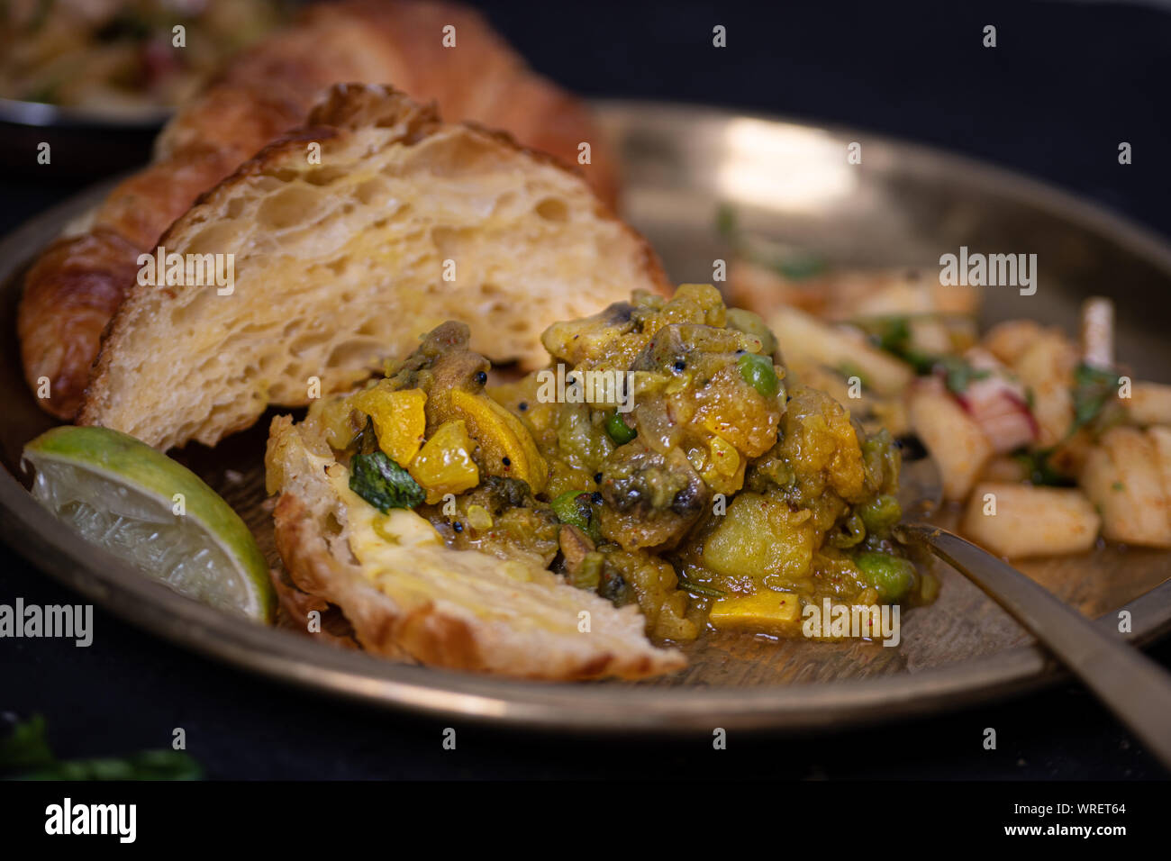 Indian Pao Bhaji- Potato Curry and Flaky Croissant Stock Photo - Alamy