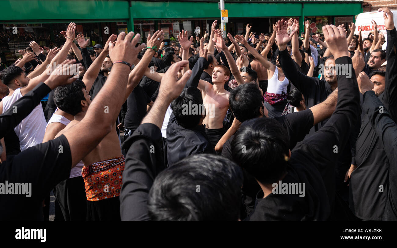 Shia men and young boys emotionally beating their chests in the Ashura ...