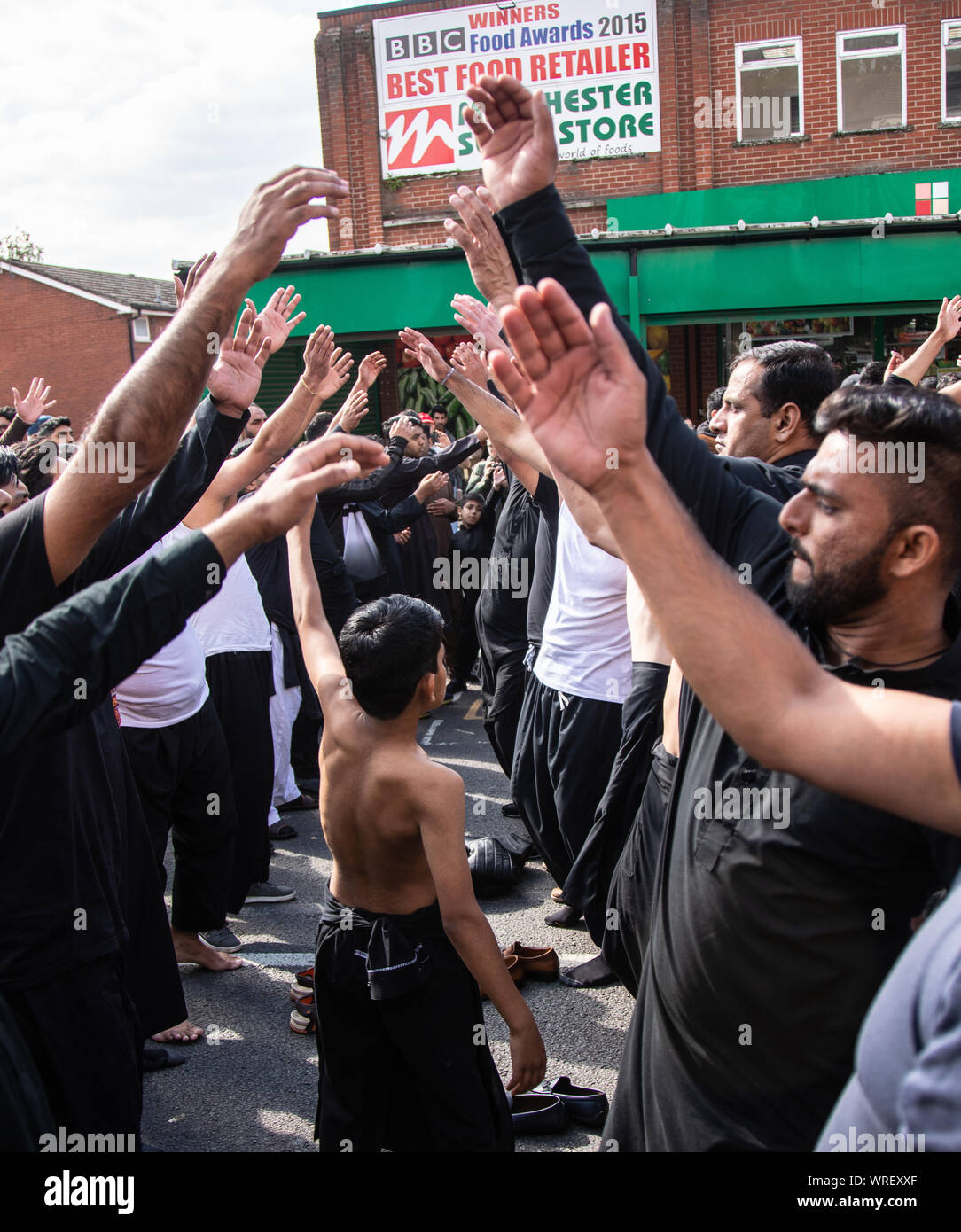 Shia men and young boys emotionally beating their chests in the Ashura ...