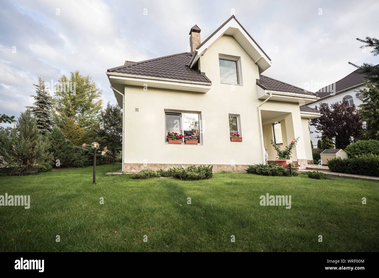 A private house and its garden in a rural area Stock Photo - Alamy