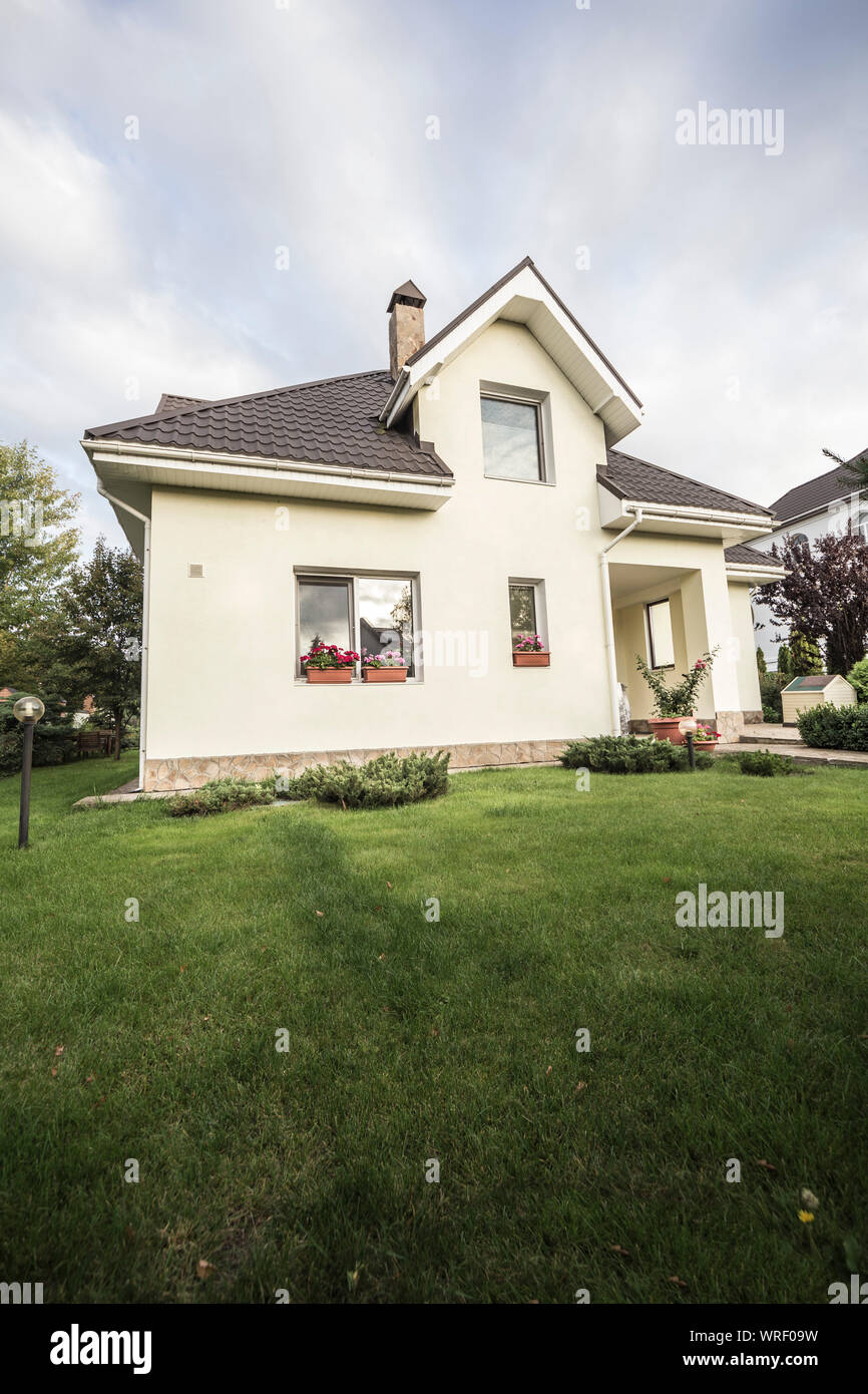 A private house and its garden in a rural area Stock Photo - Alamy