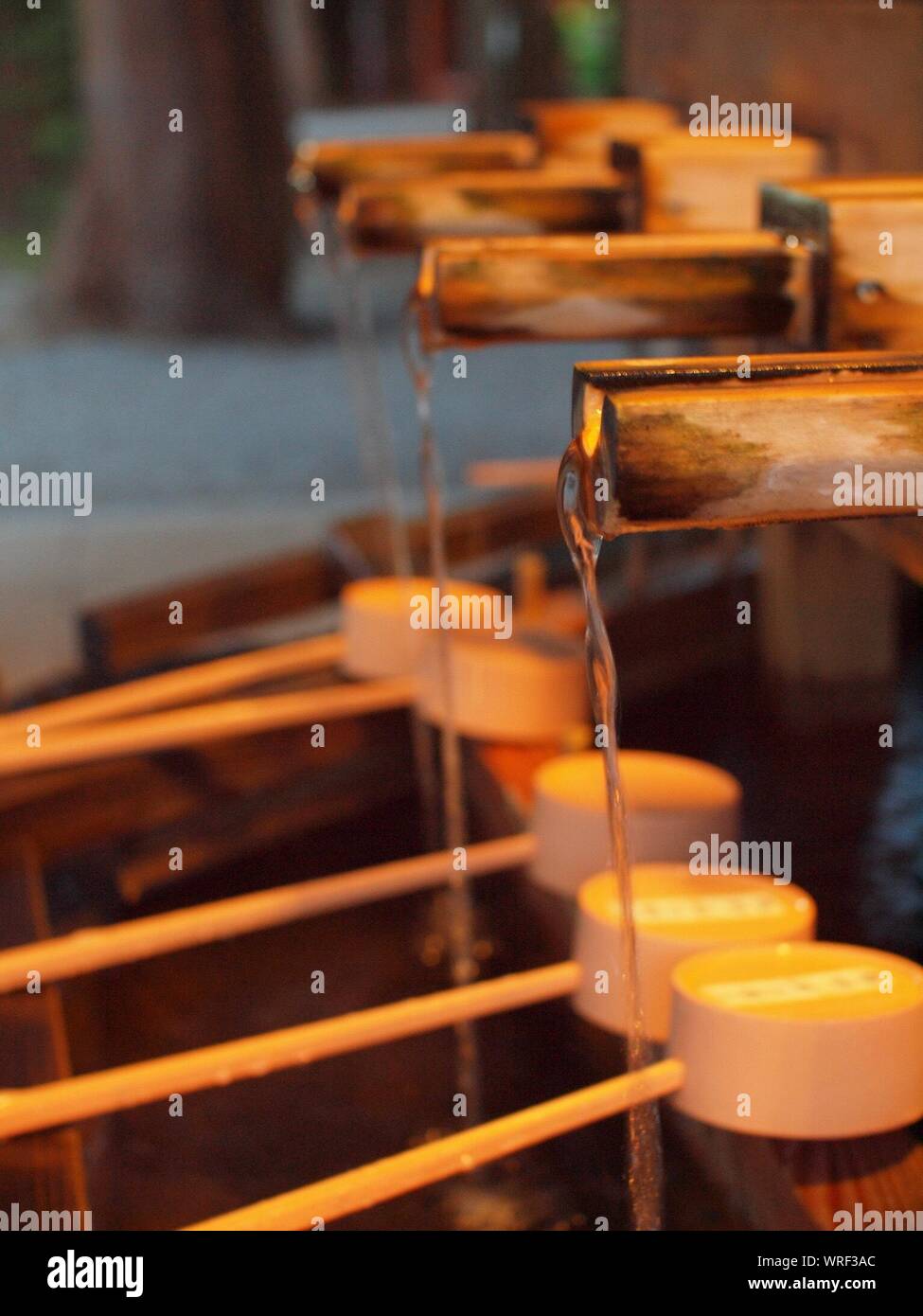 Water Flowing Into Bamboo Dipper Stock Photo - Alamy