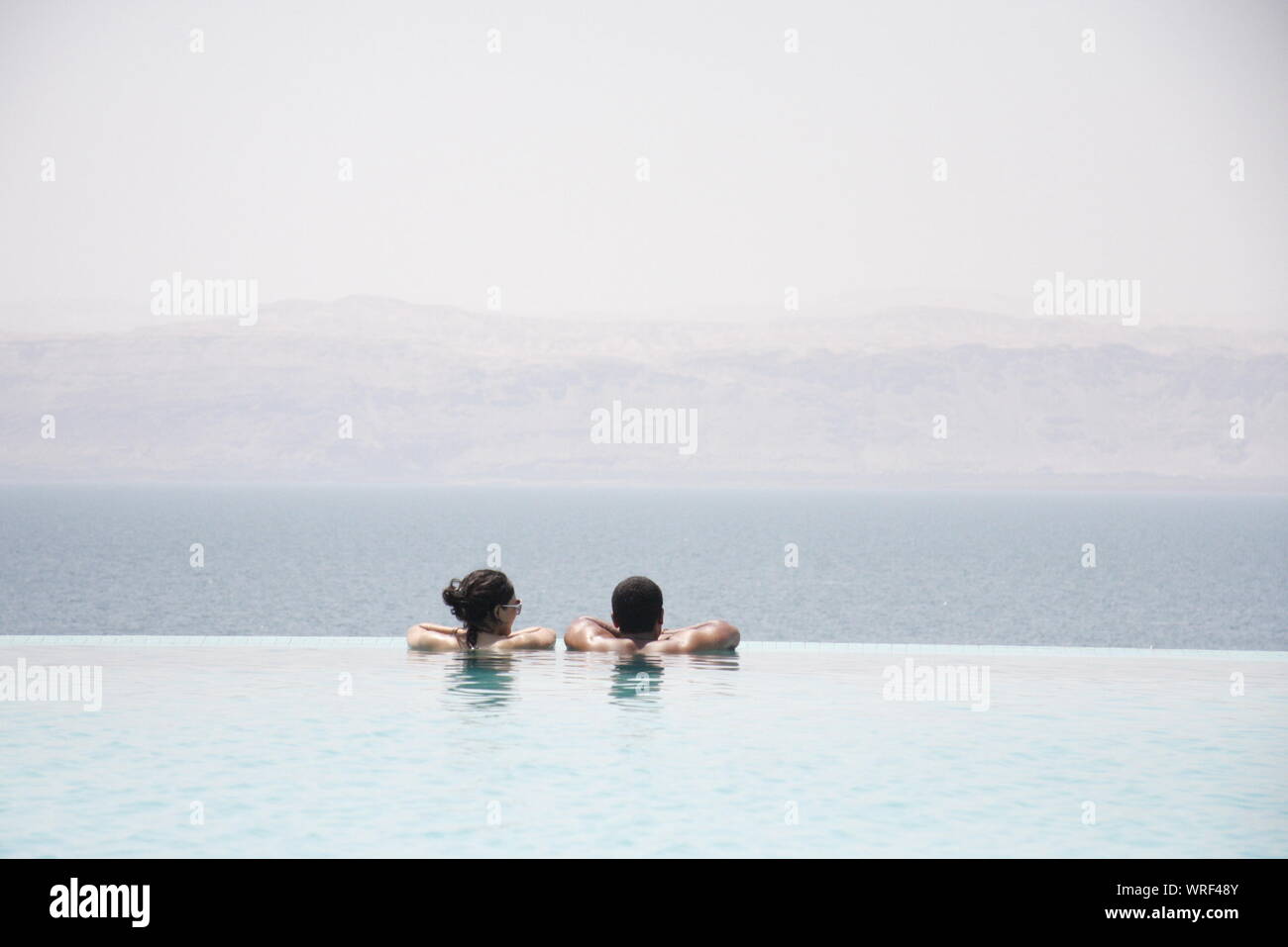 Couple pool sea hi-res stock photography and images - Alamy