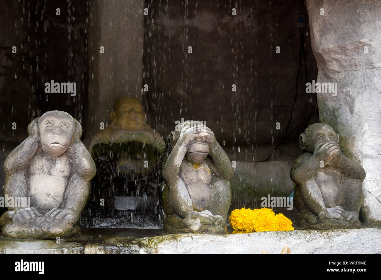 Statue at the Golden Mountain in Bangkok. Three monkeys in the ...