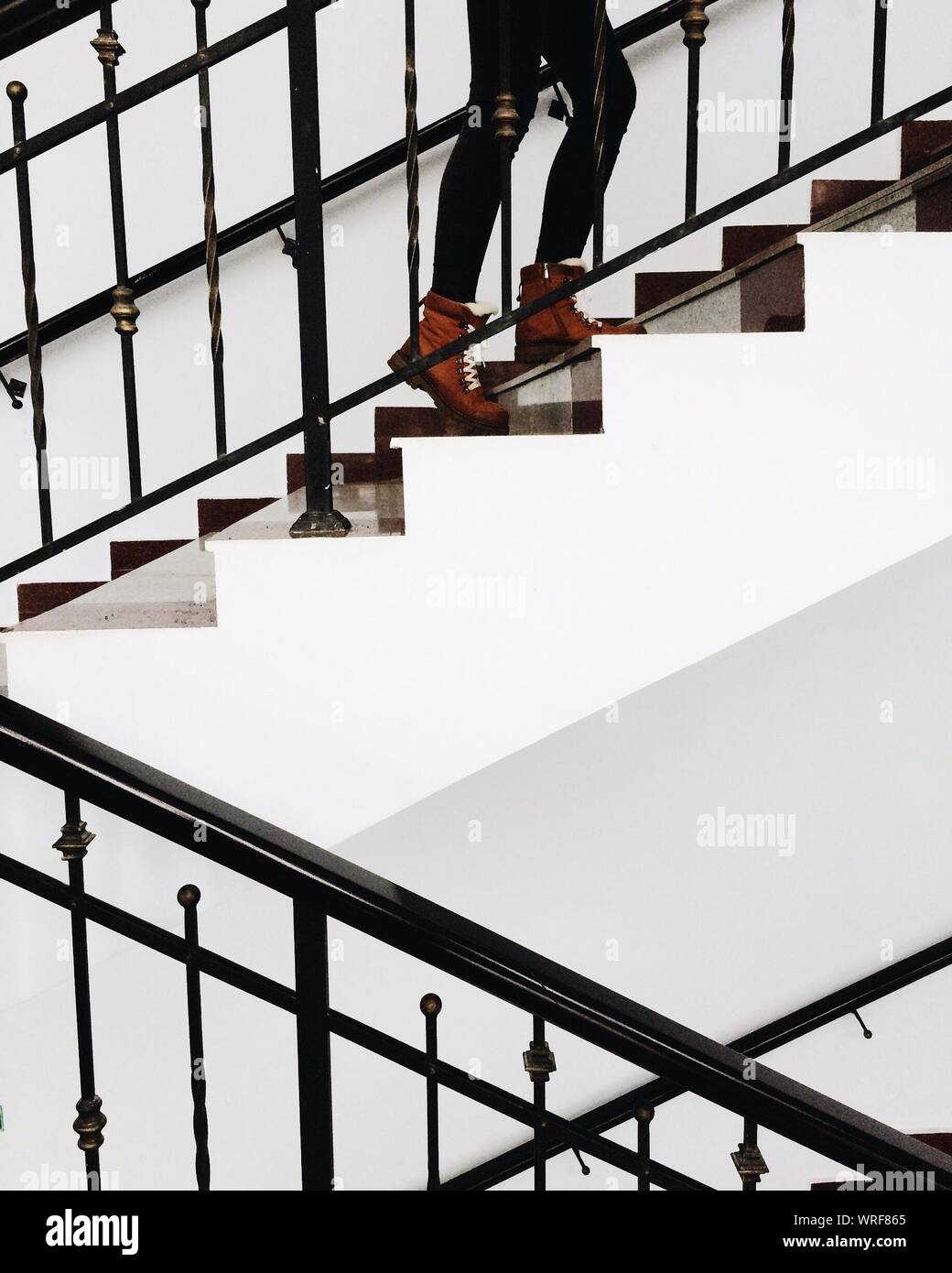 Person walking up stairs hi-res stock photography and images - Alamy