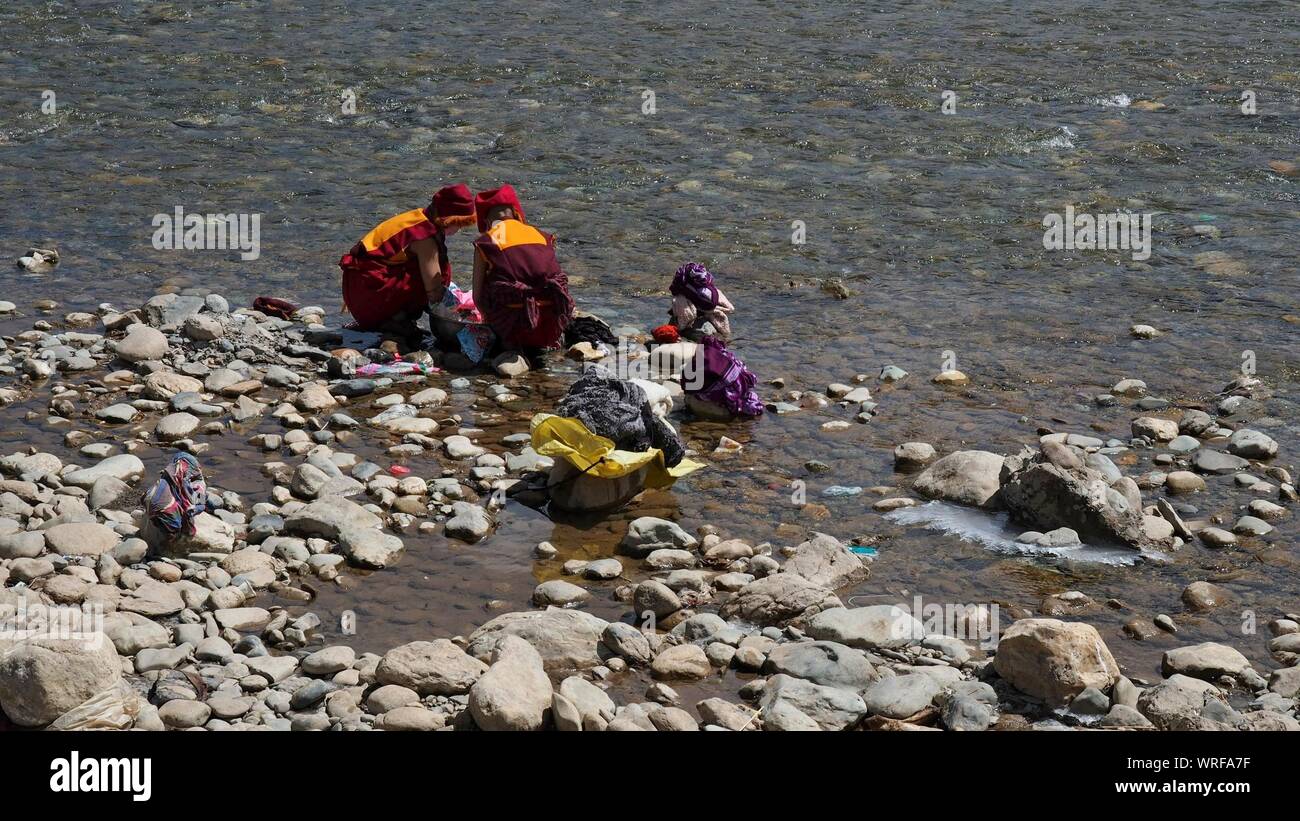 People washing clothes hi-res stock photography and images - Alamy