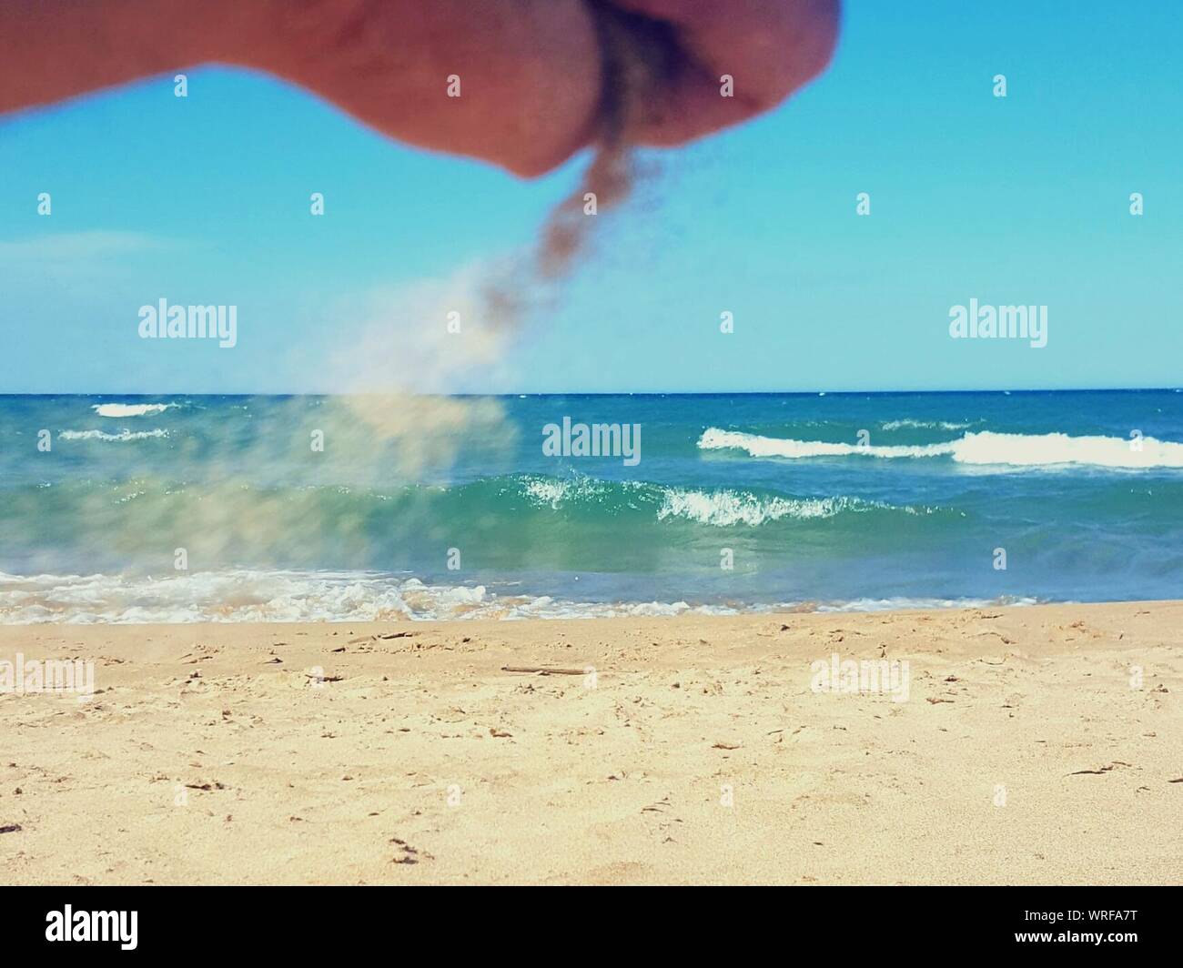 Water falling over hand hi-res stock photography and images - Alamy