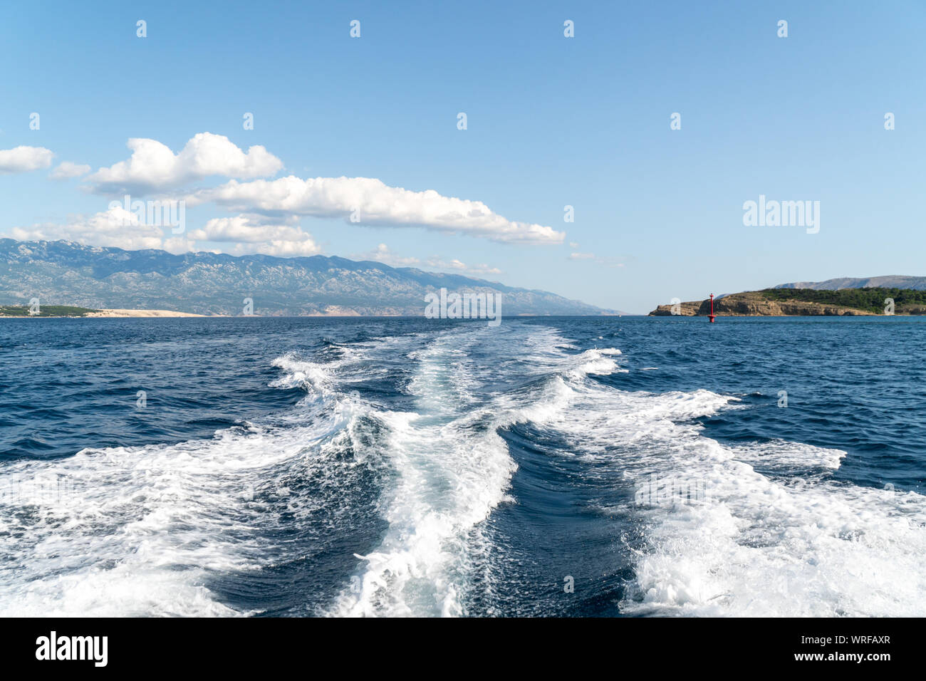 Photo of wave traces on the blue ocean surface with copy space Stock ...