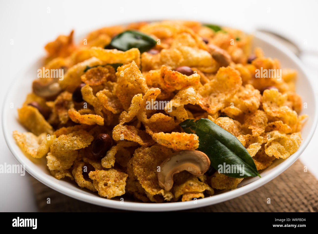 Cornflake Chivda or Corn Chiwda loaded with peanuts and Cashew. Served ...
