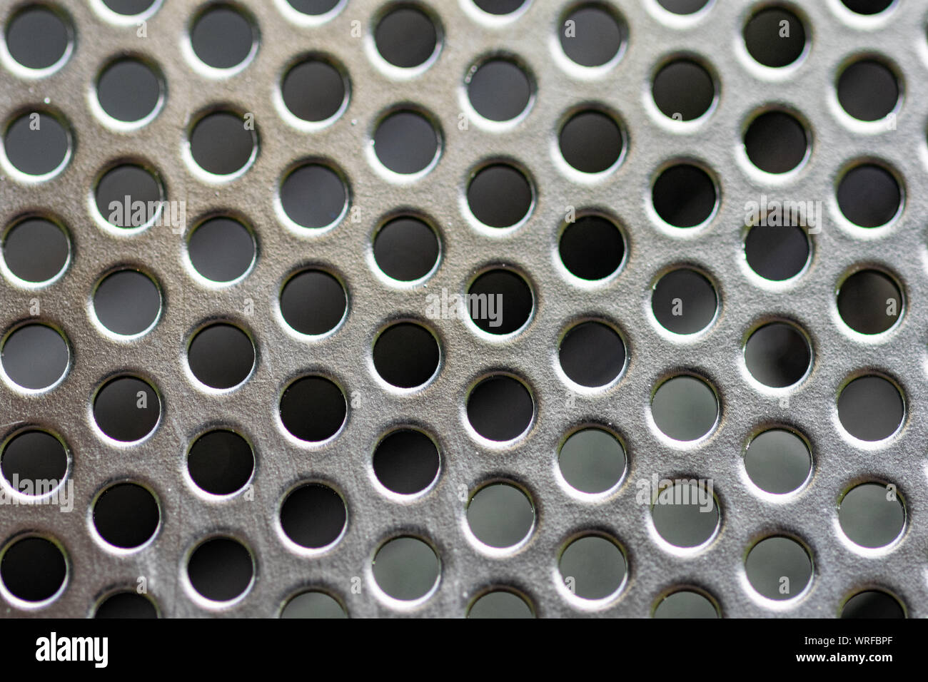 Holes providing music speaker protection Stock Photo - Alamy
