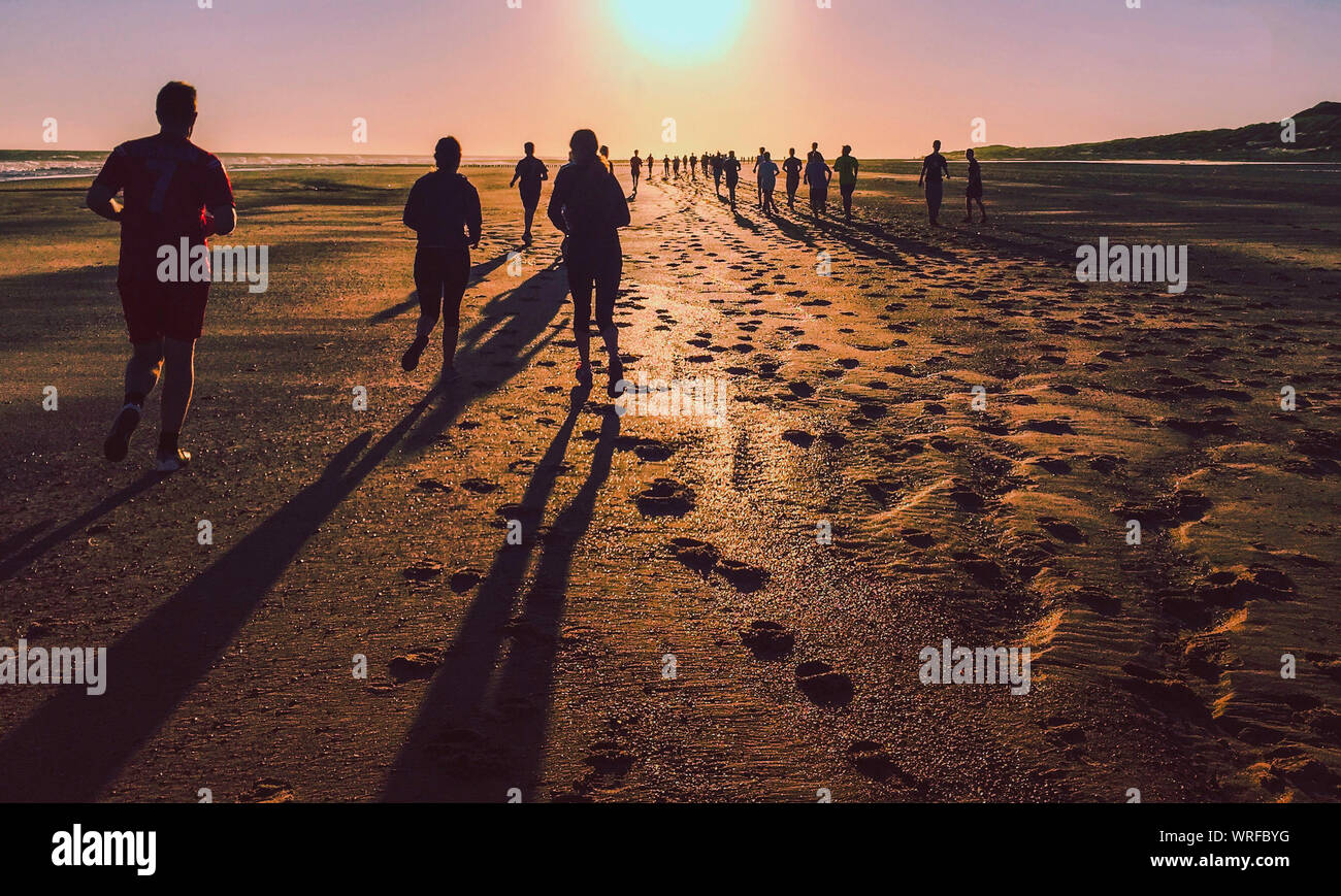Group people beach standing island hi-res stock photography and images ...