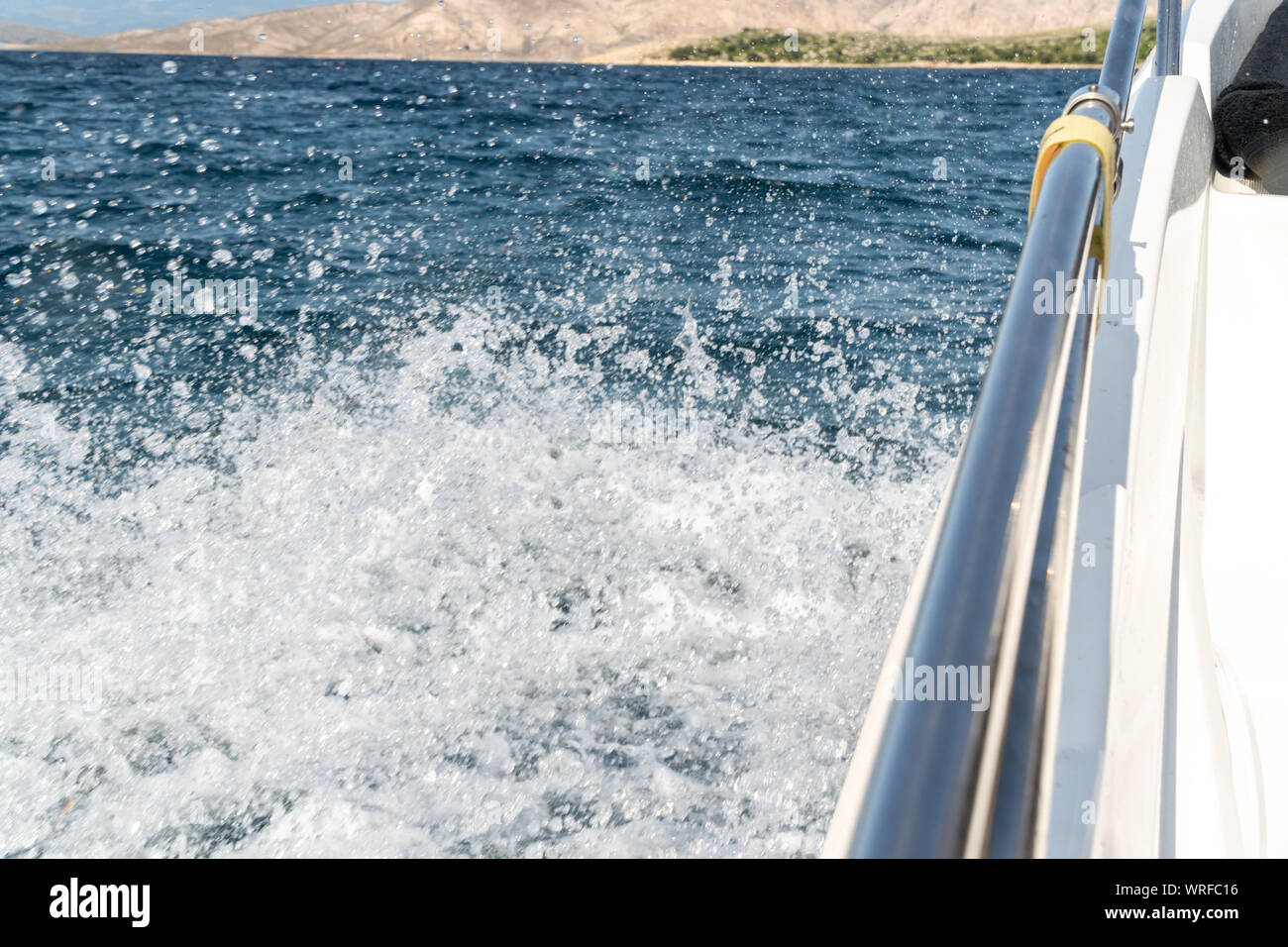 Photo of wave traces on the blue ocean surface with copy space Stock ...