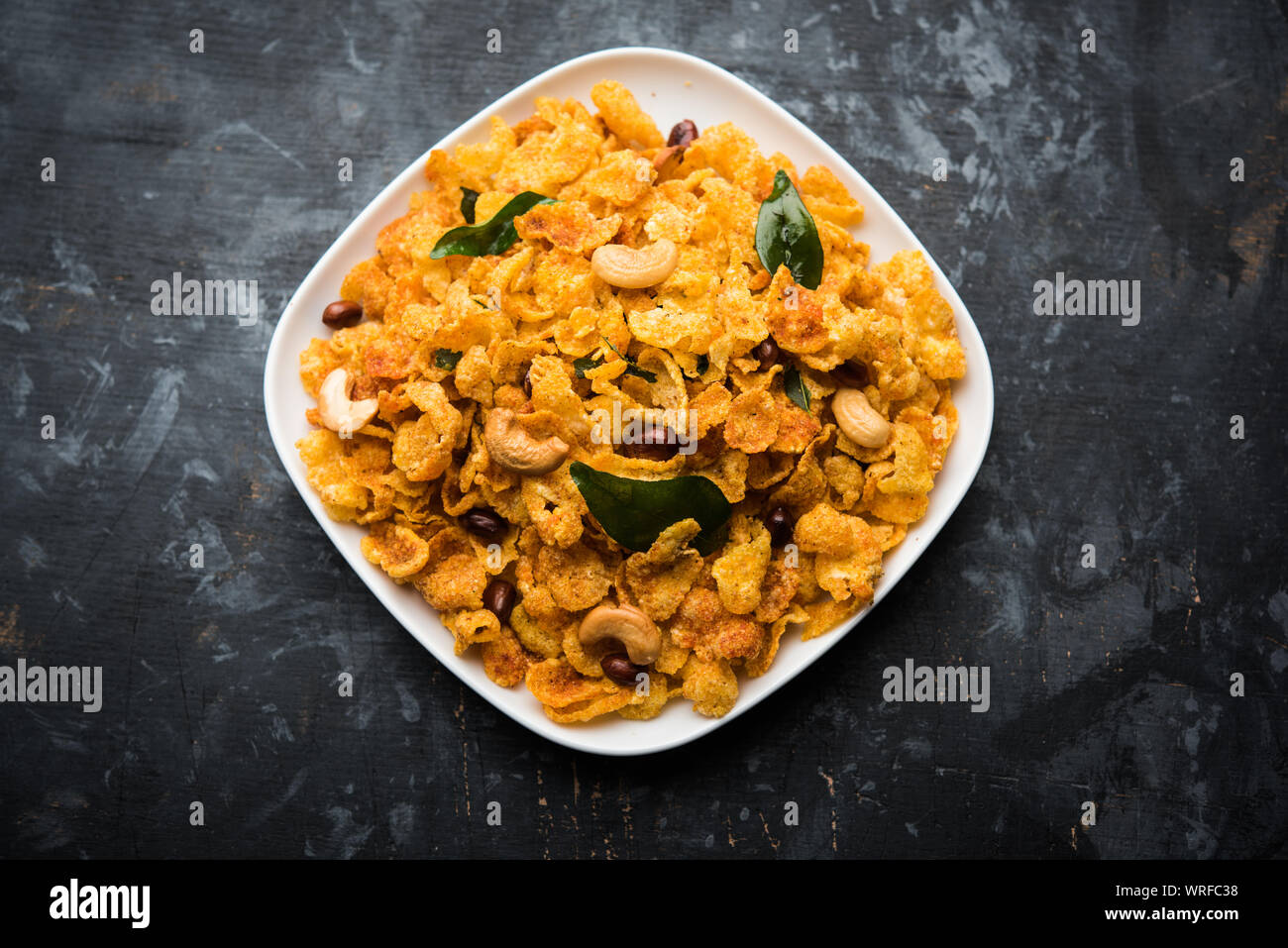 Cornflake Chivda or Corn Chiwda loaded with peanuts and Cashew. Served ...