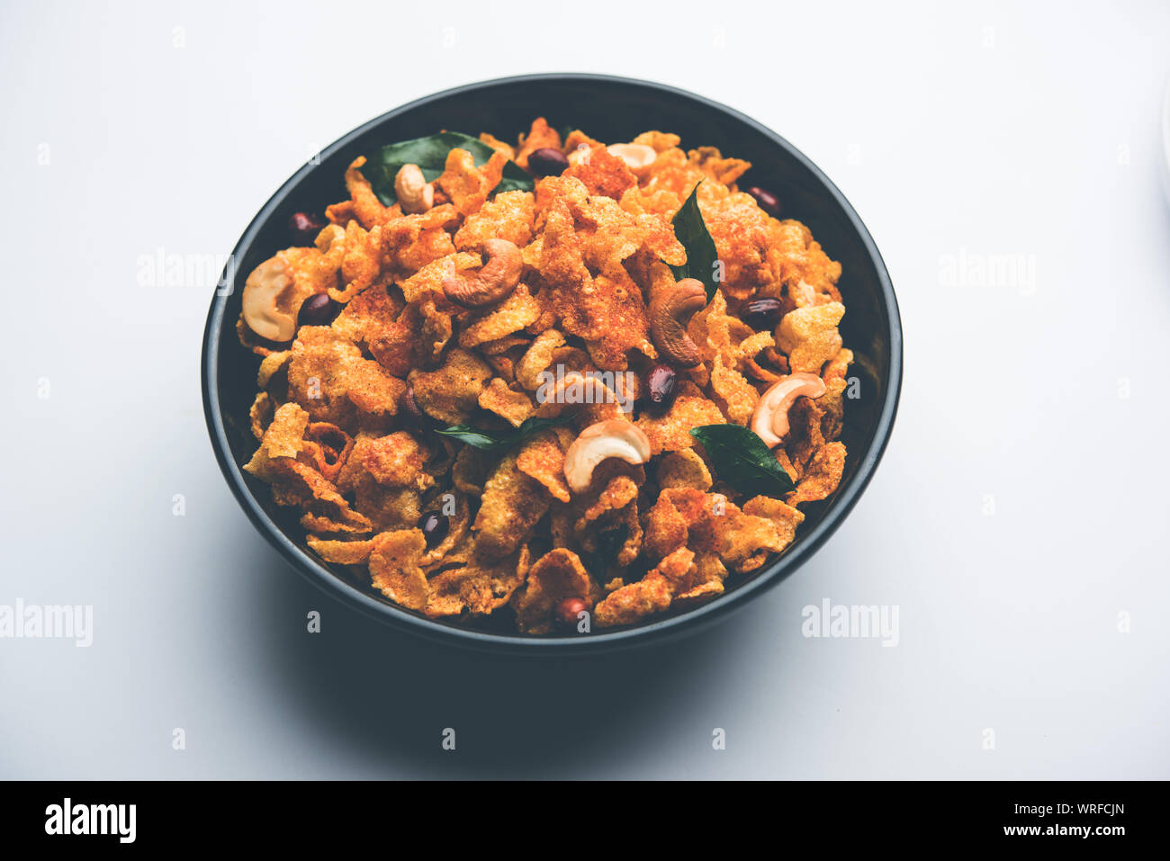 Cornflake Chivda or Corn Chiwda loaded with peanuts and Cashew. Served ...