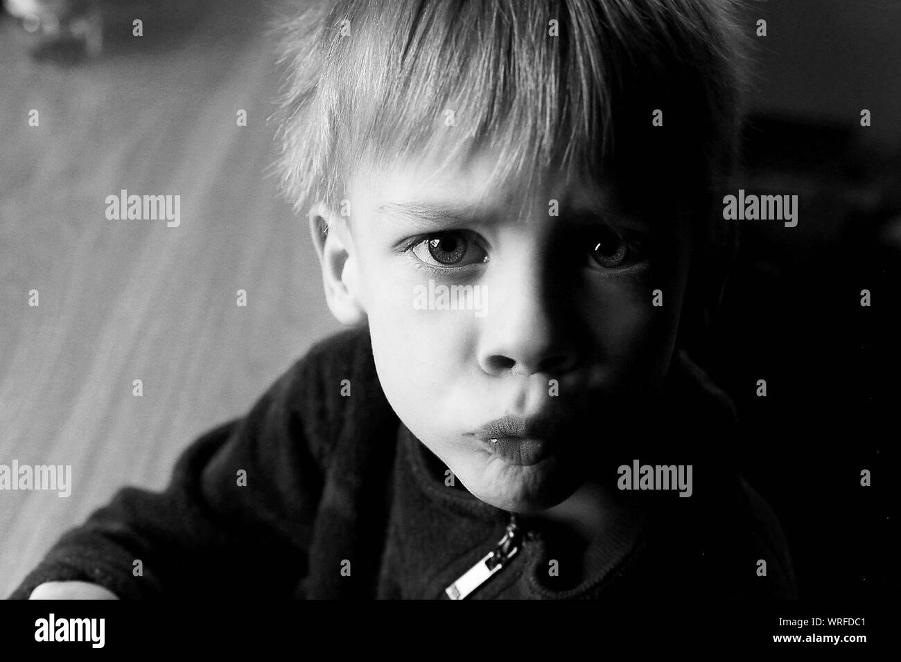 Child frowning hi-res stock photography and images - Alamy