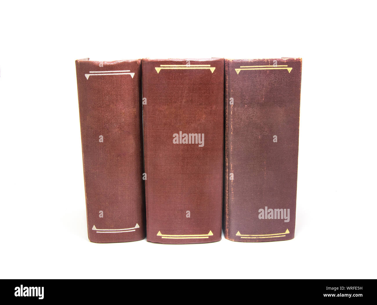 Three brown books isolated on white background Stock Photo - Alamy