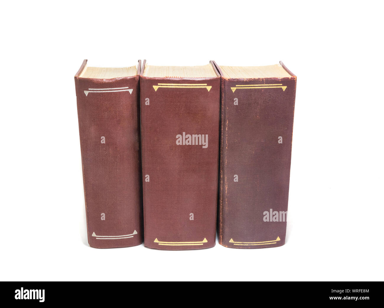 Three brown books isolated on white background Stock Photo - Alamy