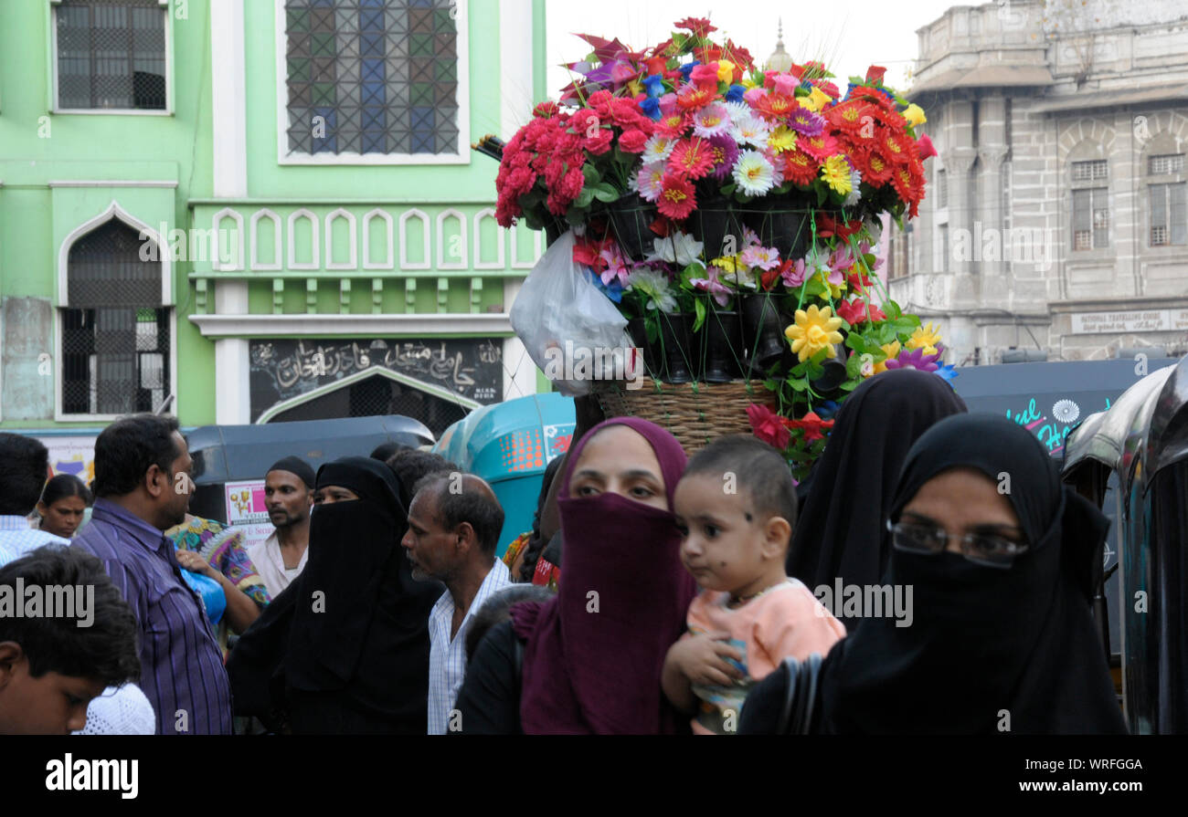 Burqua clad muslim women throng a market in old Hyderabad city of South ...