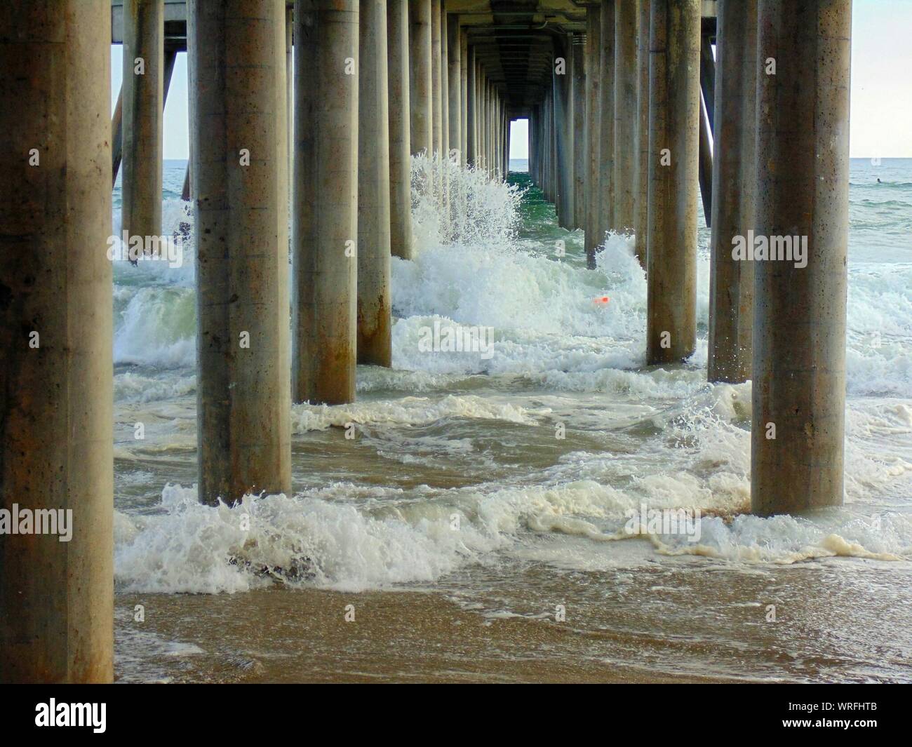 Water Flowing Through Bridge Columns Stock Photo - Alamy