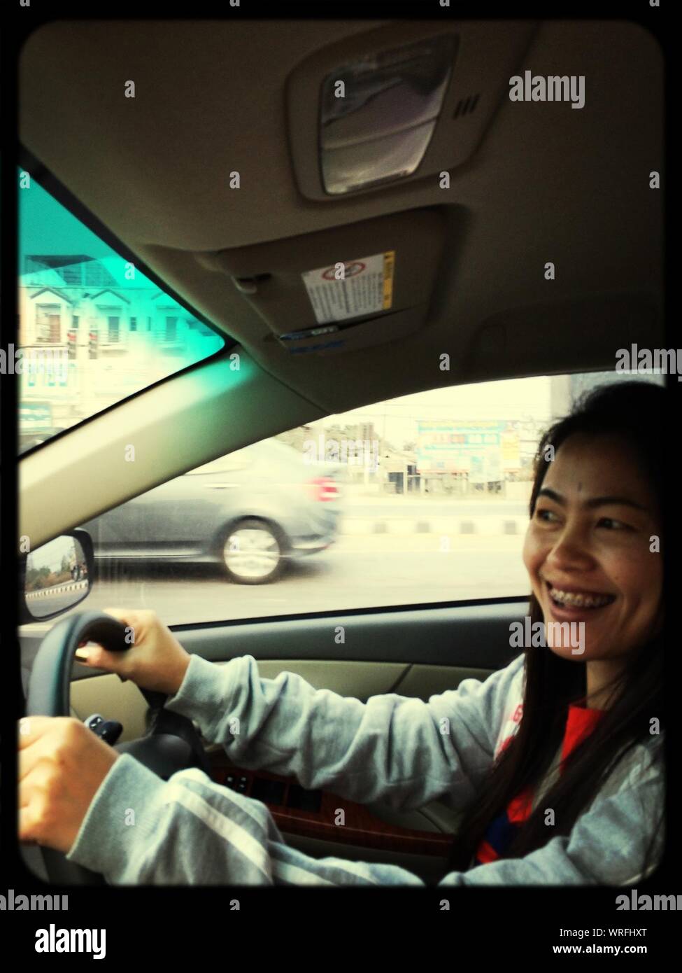 Asian woman driving car hi-res stock photography and images - Alamy