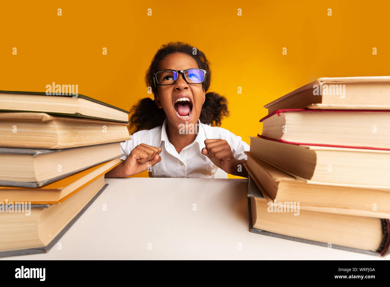 Angry Little Girl Shouting Doing Homework Sitting Between Book Stacks ...