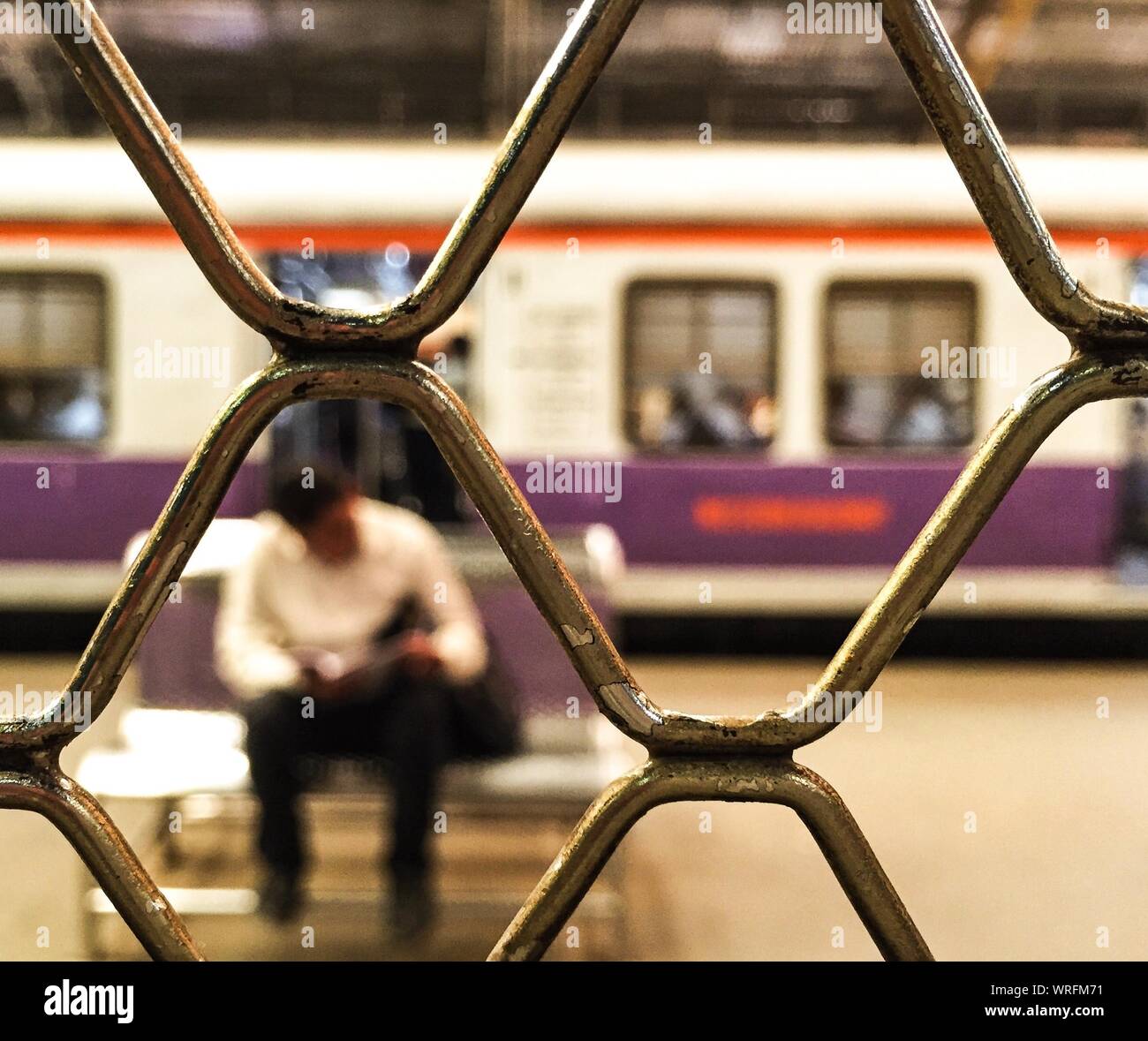 Man train station bench hi-res stock photography and images - Alamy