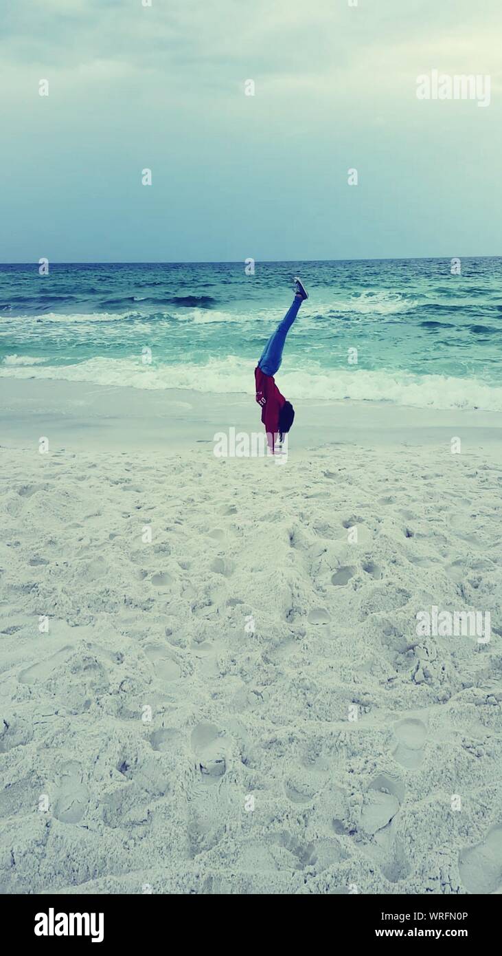 Woman handstand beach sand hi-res stock photography and images - Alamy