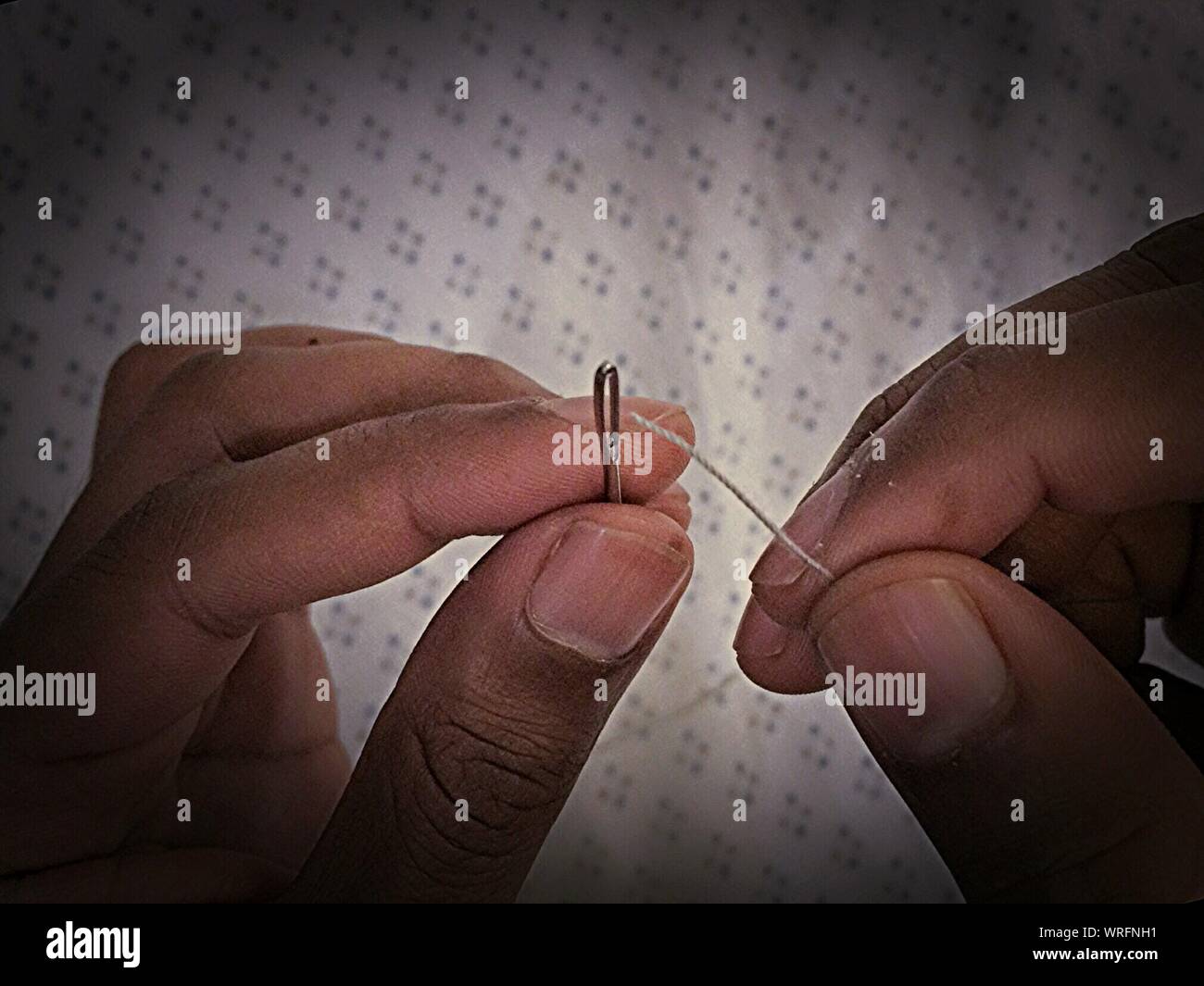 Hand threading hi-res stock photography and images - Alamy