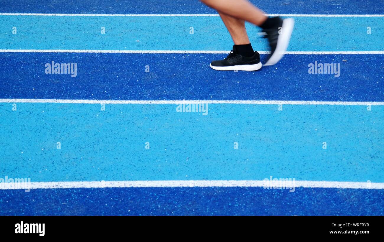 Man running track blurred motion hi-res stock photography and images ...