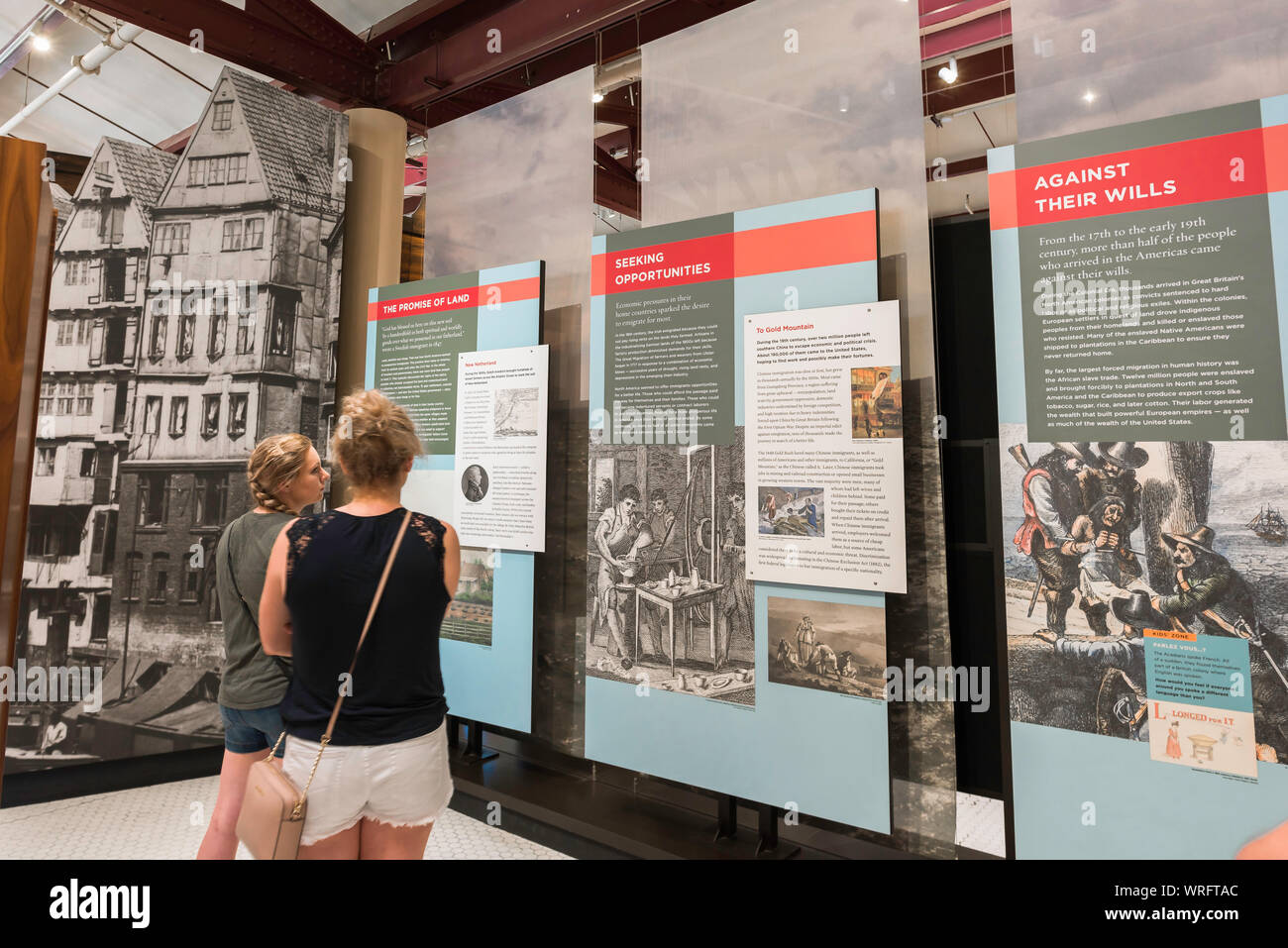 Women museum, rear view of two young women tourists looking at a ...
