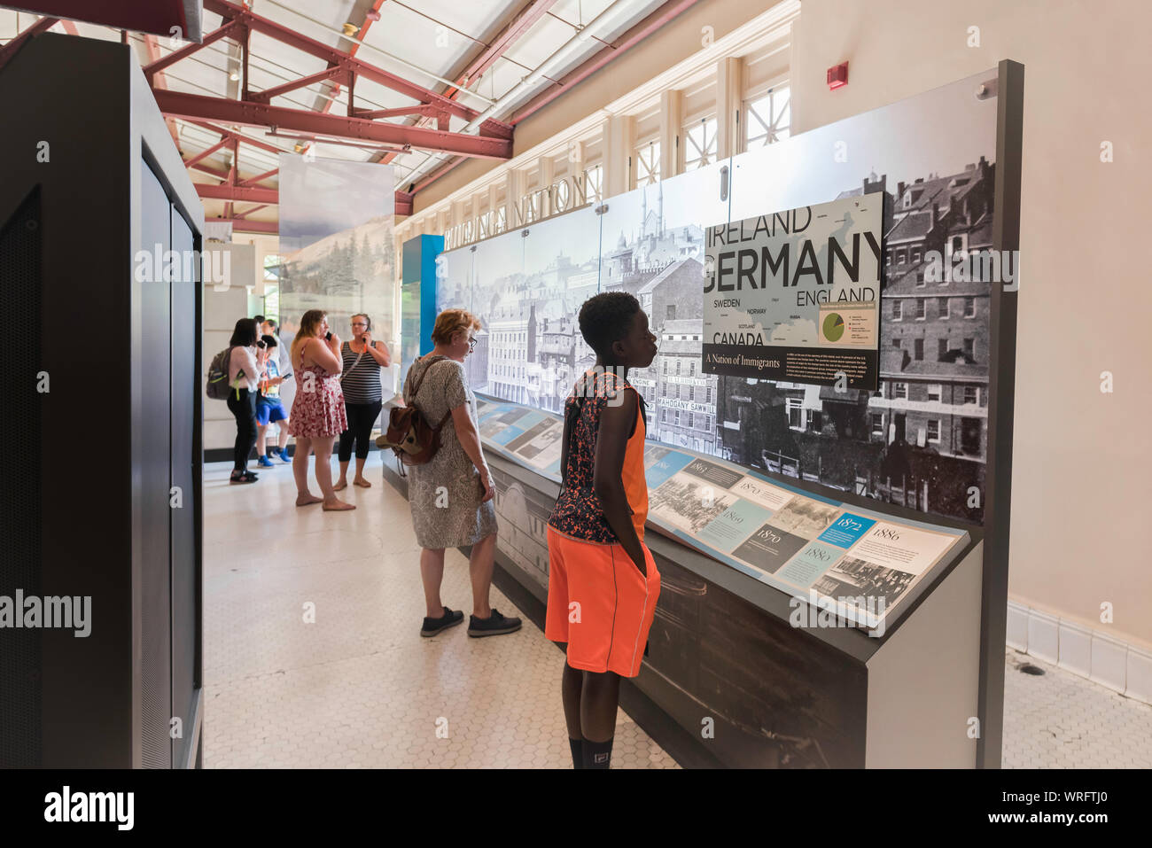 Ellis Island New York, view of tourists visiting the Peopling Of ... Ellis Island New York, view of tourists visiting the Peopling Of ...