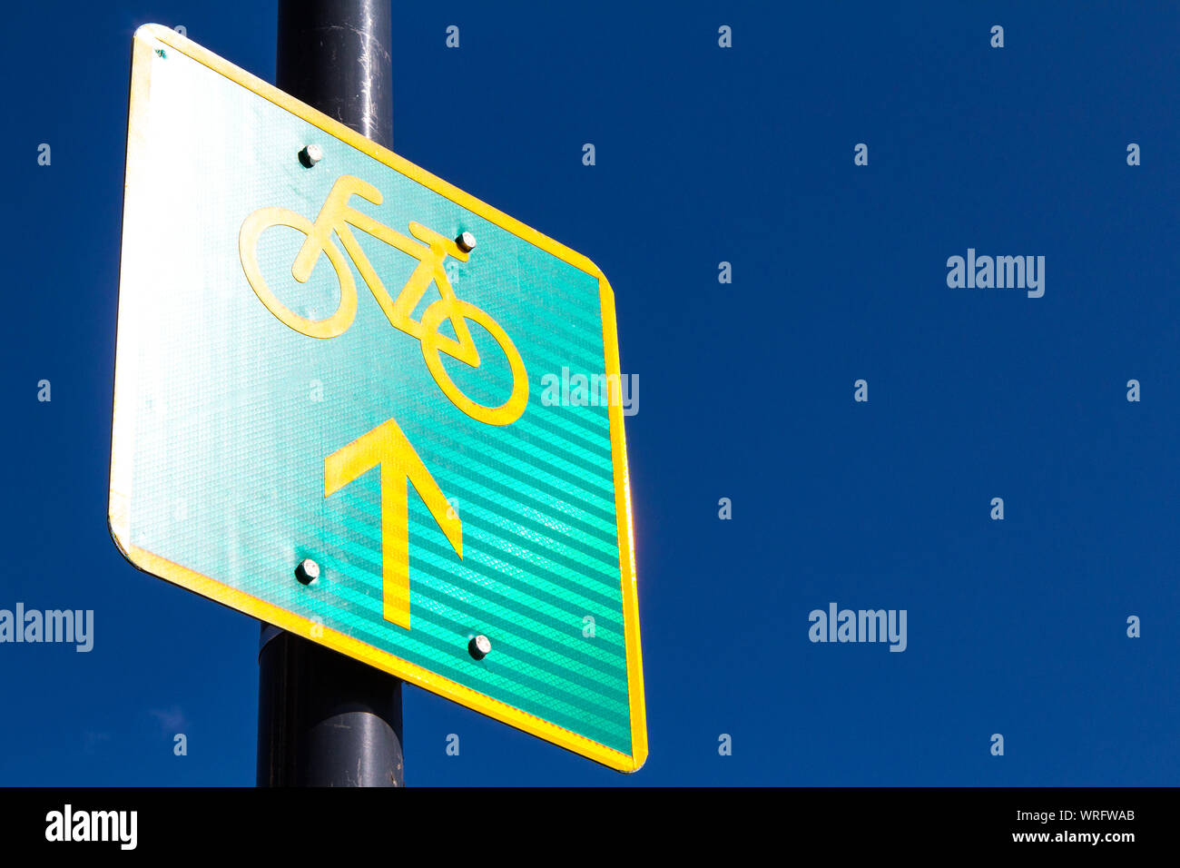 Fluorescent green and yellow cycle route sign in Hungary Stock Photo ...