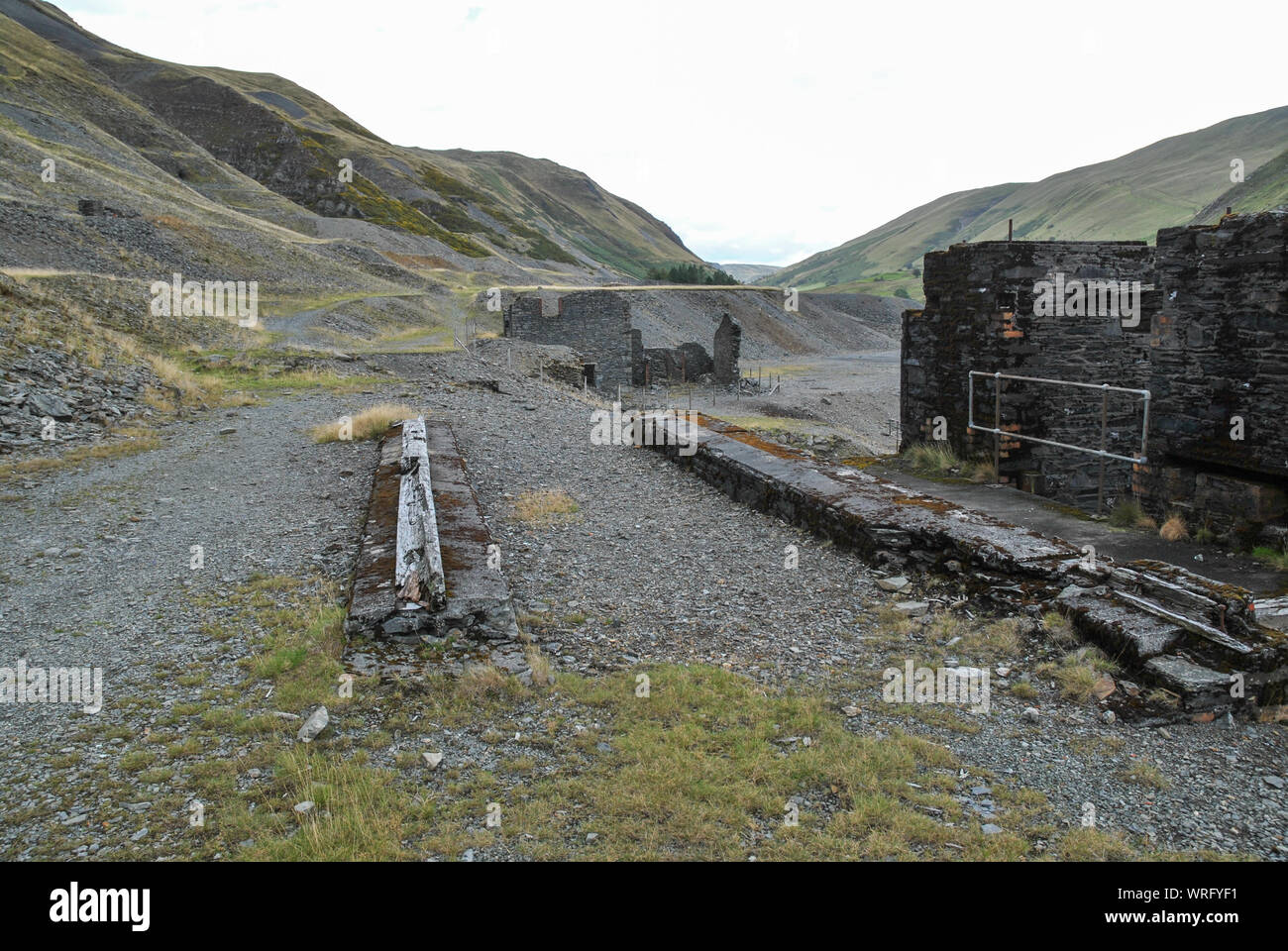 A scene looking across Cwmystwyth Mines showing old ruined buildings ...