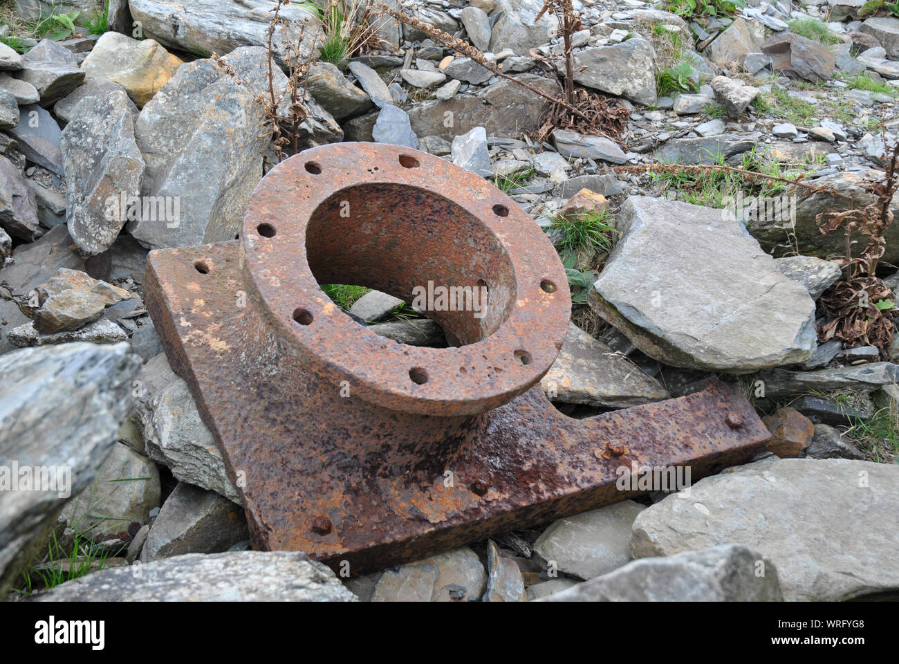 A large piece of discarded mining machinery lying on the ground at ...
