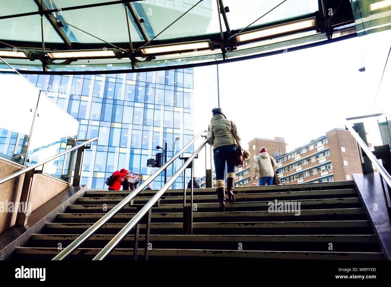Woman walking stairs building hi-res stock photography and images - Alamy