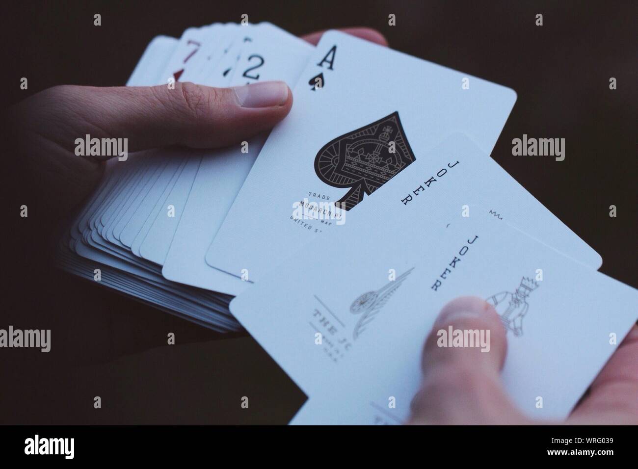 Holding playing cards hi-res stock photography and images - Alamy