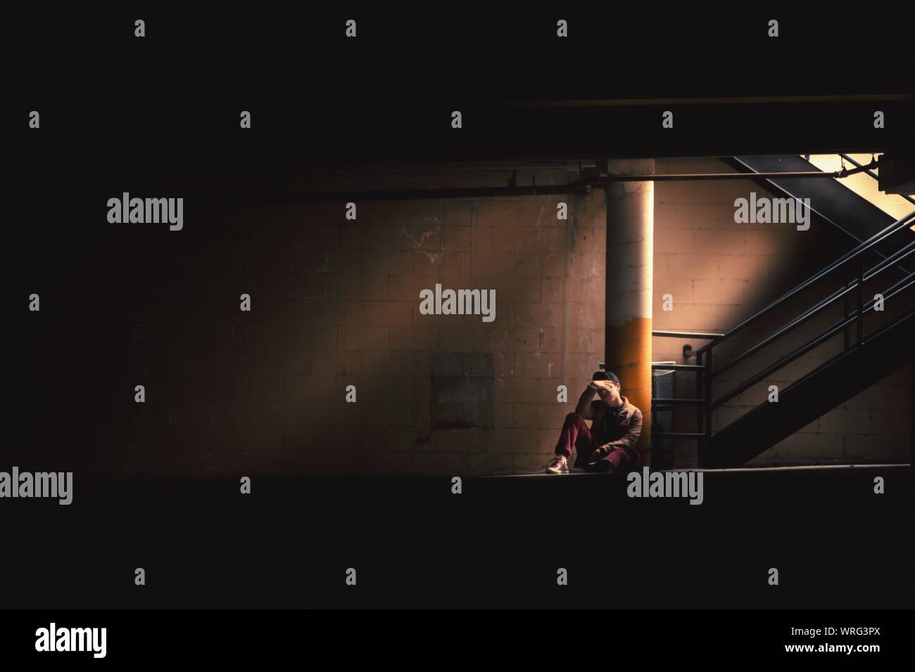 Man sitting in dark room hi-res stock photography and images - Alamy