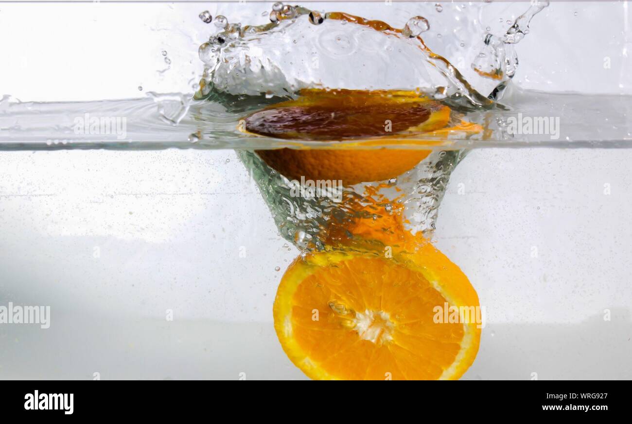 White background orange in water hi-res stock photography and images ...