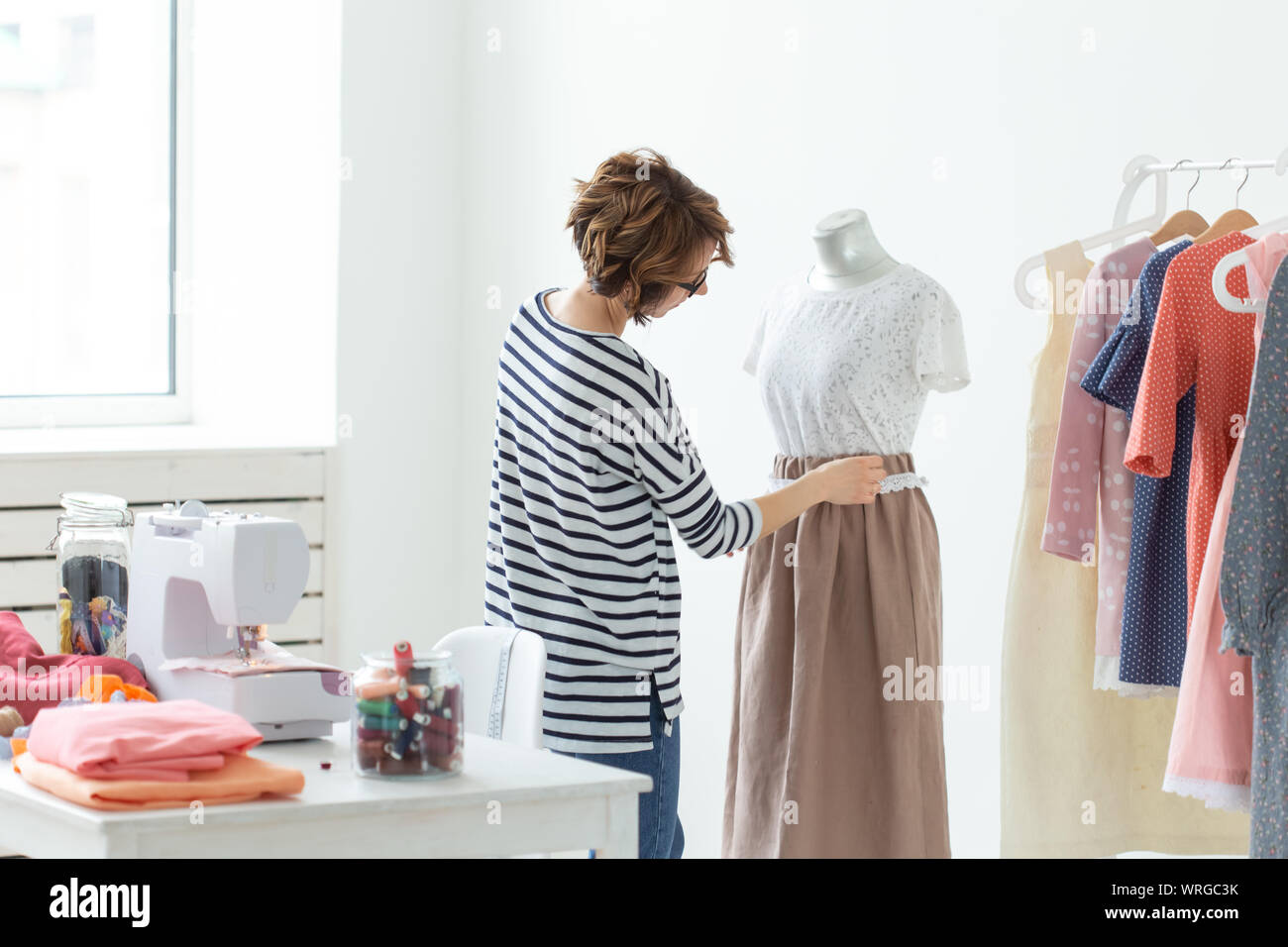 Fashion designer, seamstress and Small-Sized Enterprises concept ...