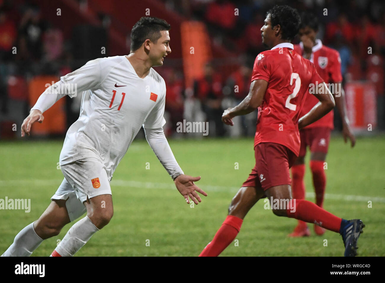 Male, Maldives. 10th Sep, 2019. Ai Kesen (L) of China celebrates after ...