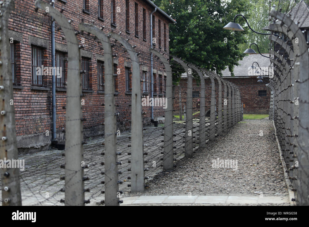 Auschwitz-Birkenau, Poland - 14 June 2019:Electric fence with barbed ...