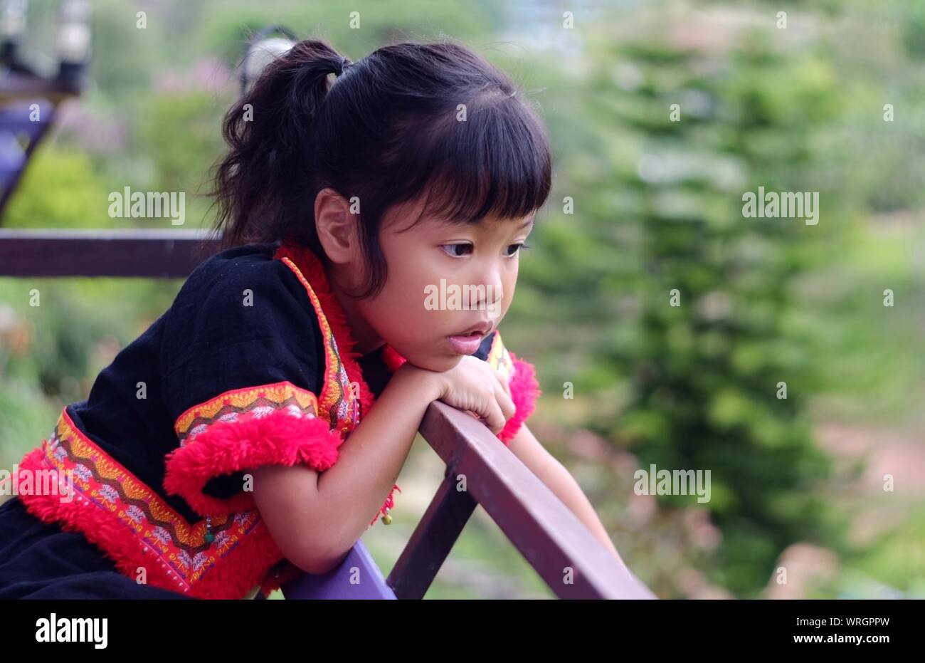 Girl standing railing balcony hi-res stock photography and images - Alamy