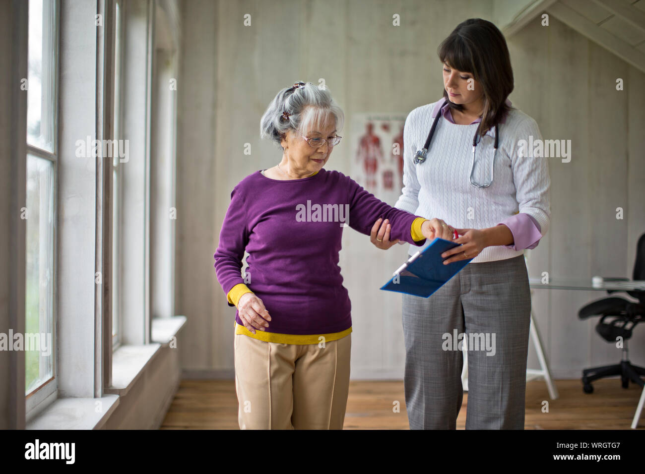 Elderly woman at a medical check-up with her doctor Stock Photo - Alamy