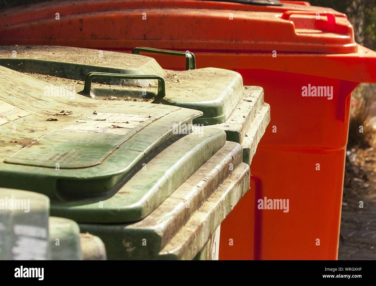 Row of garbage cans hi-res stock photography and images - Alamy