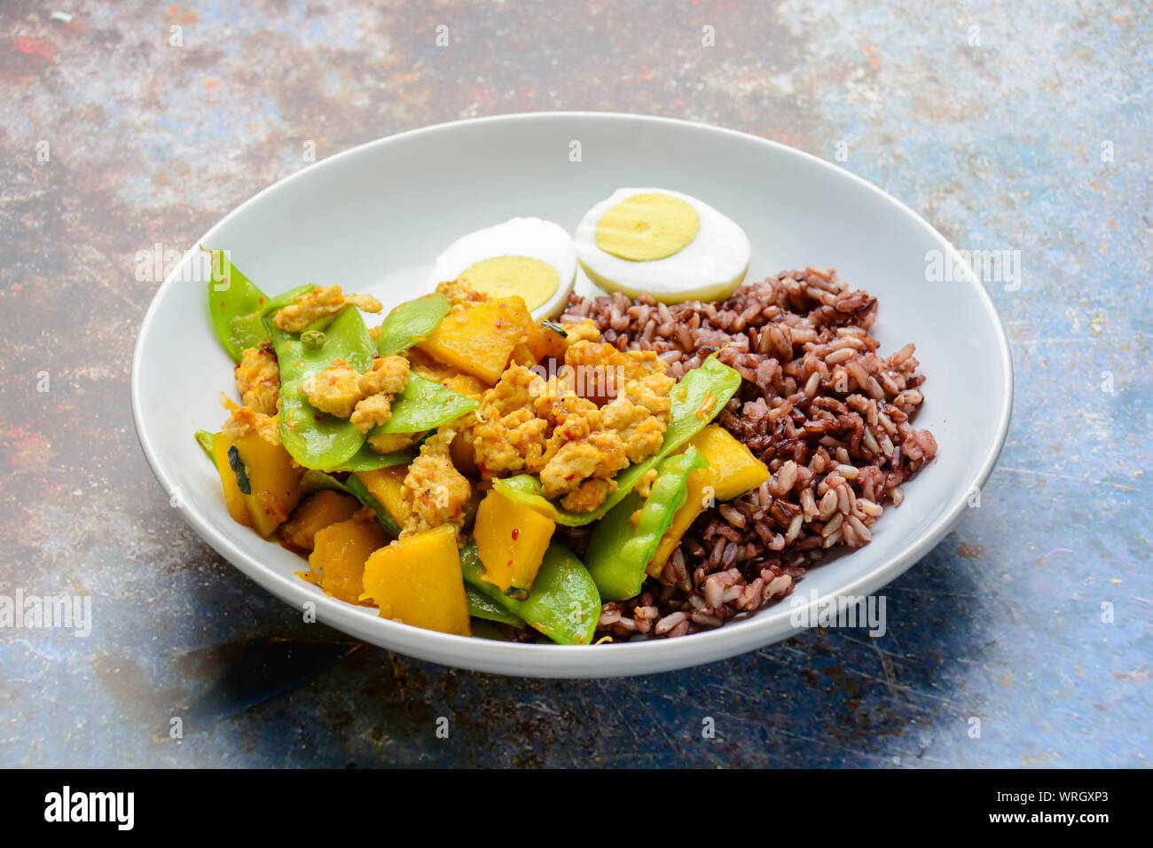 Stir Fry Snow Peas with pumpkin and chicken, served with brown rice and ...