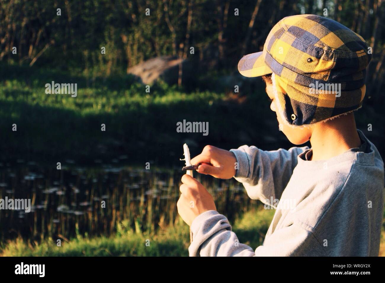 Boy with stick hi-res stock photography and images - Alamy