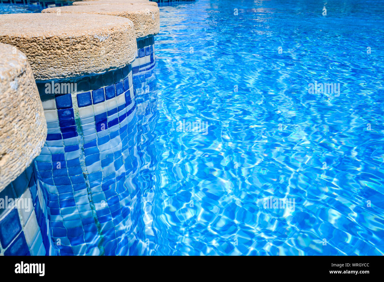 Pillars inside a pool to separate bathing areas Stock Photo - Alamy