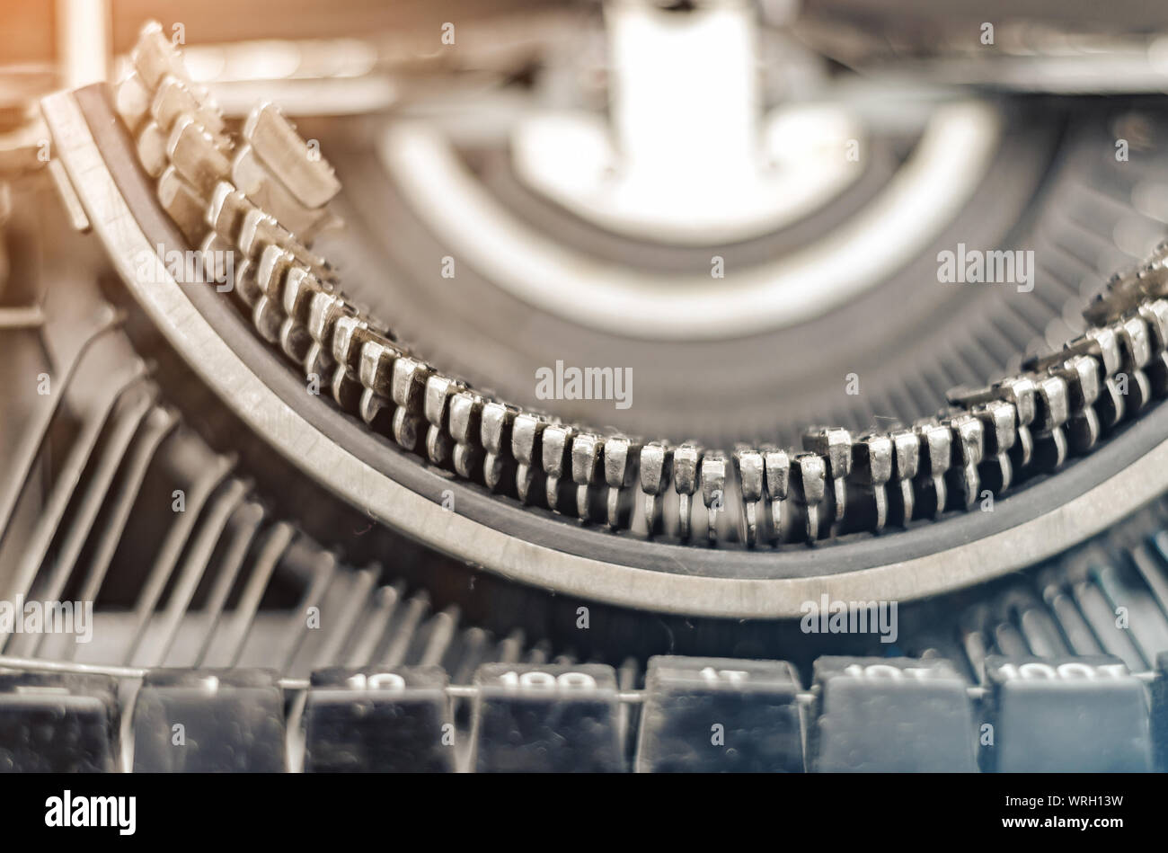 Carriage block with letters in an old mechanical typewriter. Close-up ...